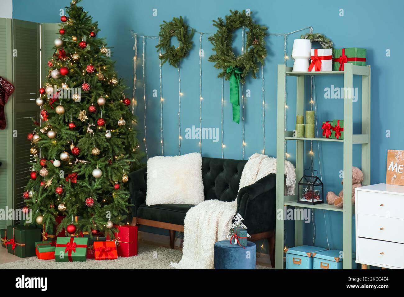 Interior of beautiful living room with glowing Christmas tree and sofa ...