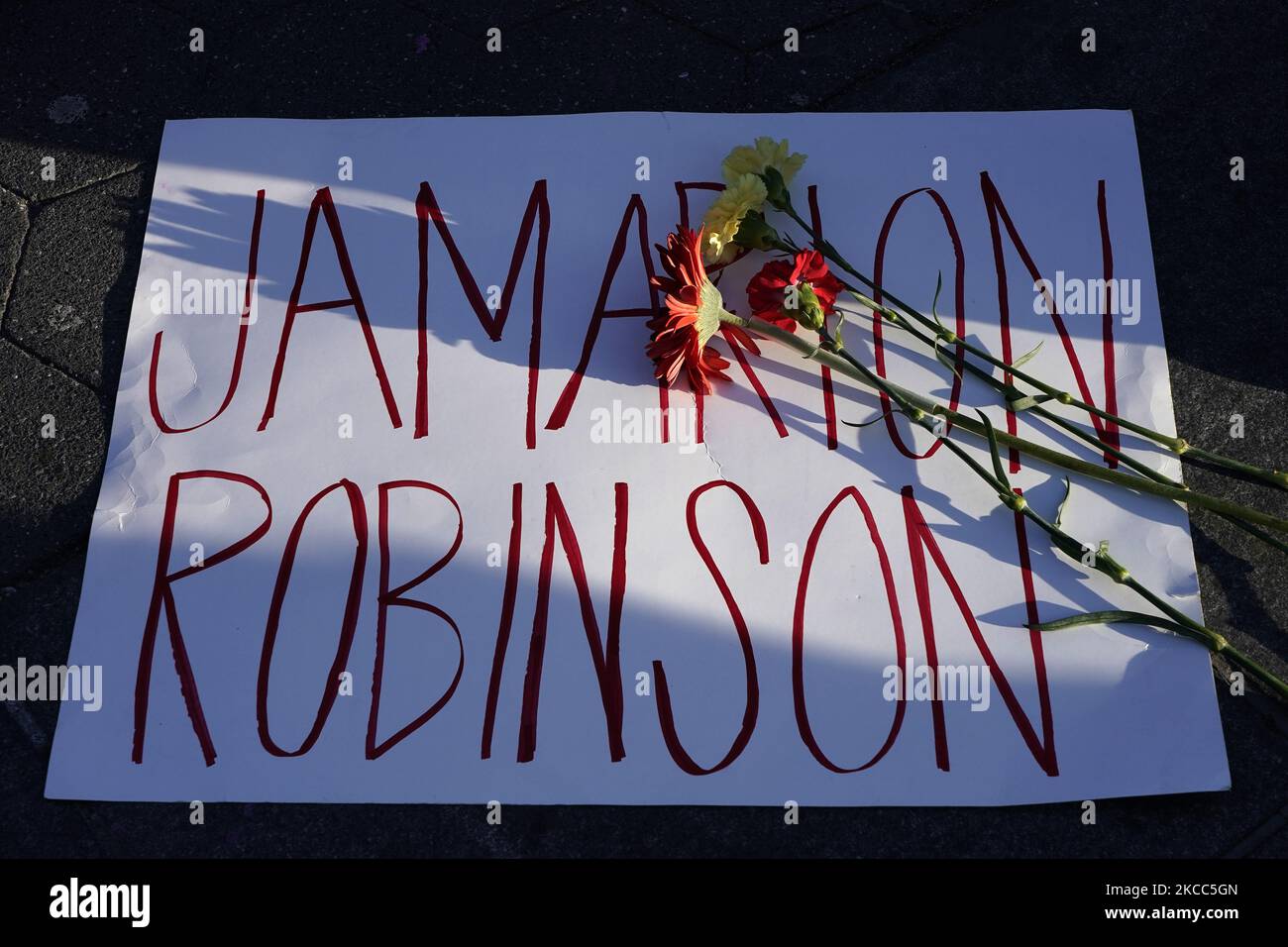 People march through the streets with balloons and placards towards ...