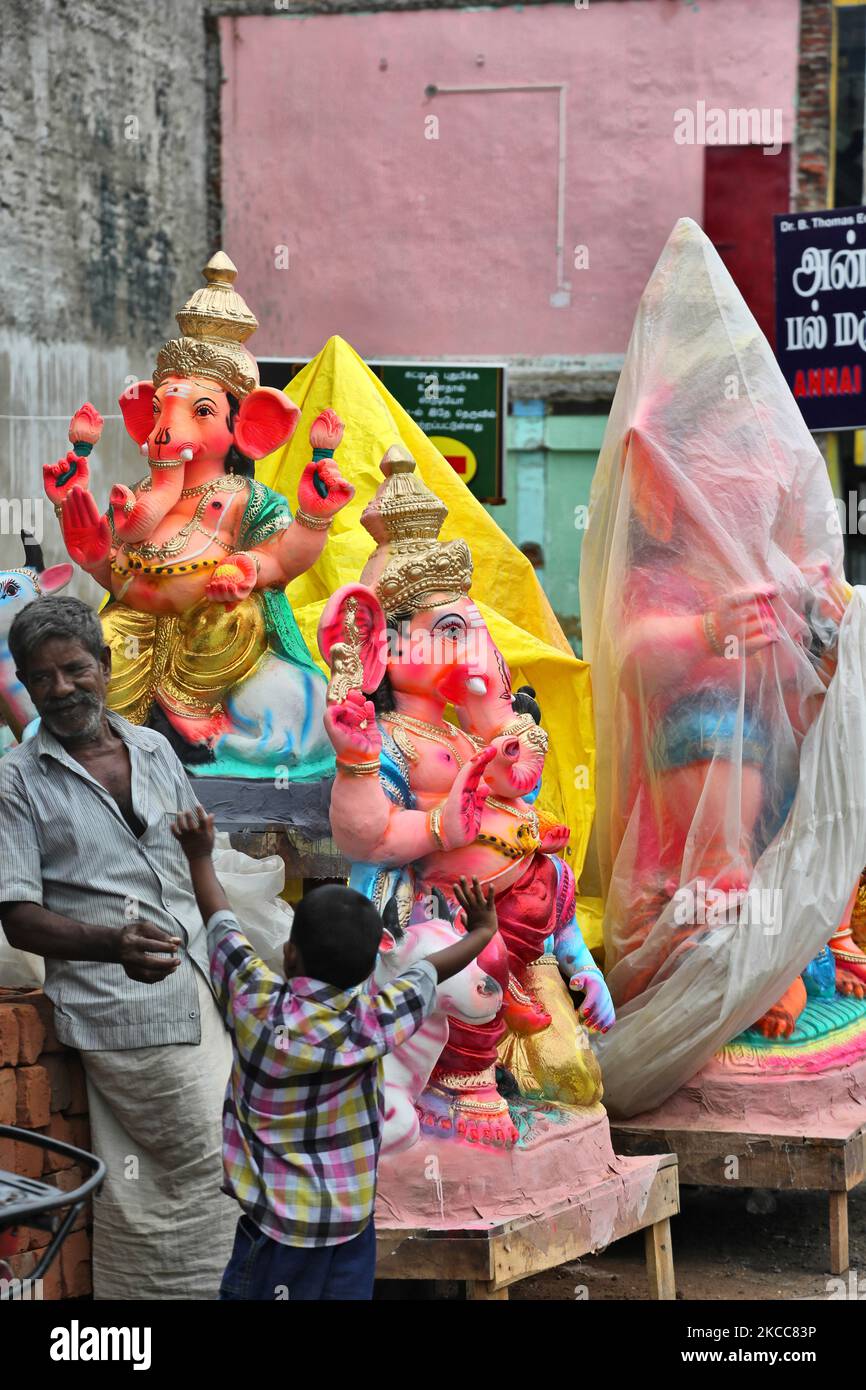 Tamil Hindus selling clay idols of Lord Ganesha (Lord Ganesh) along the ...