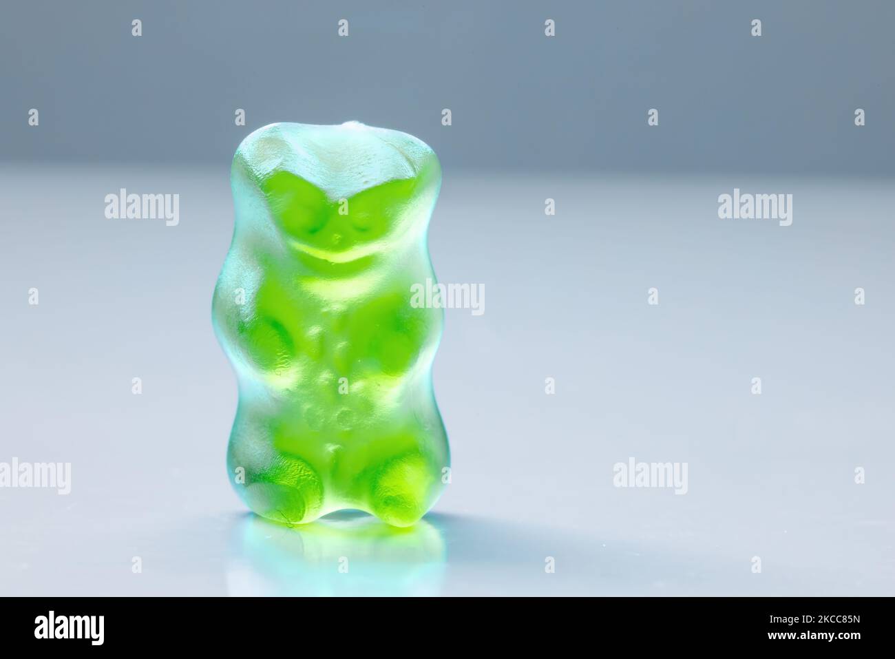 A Green gummy bear candy fruity flavours Stock Photo - Alamy