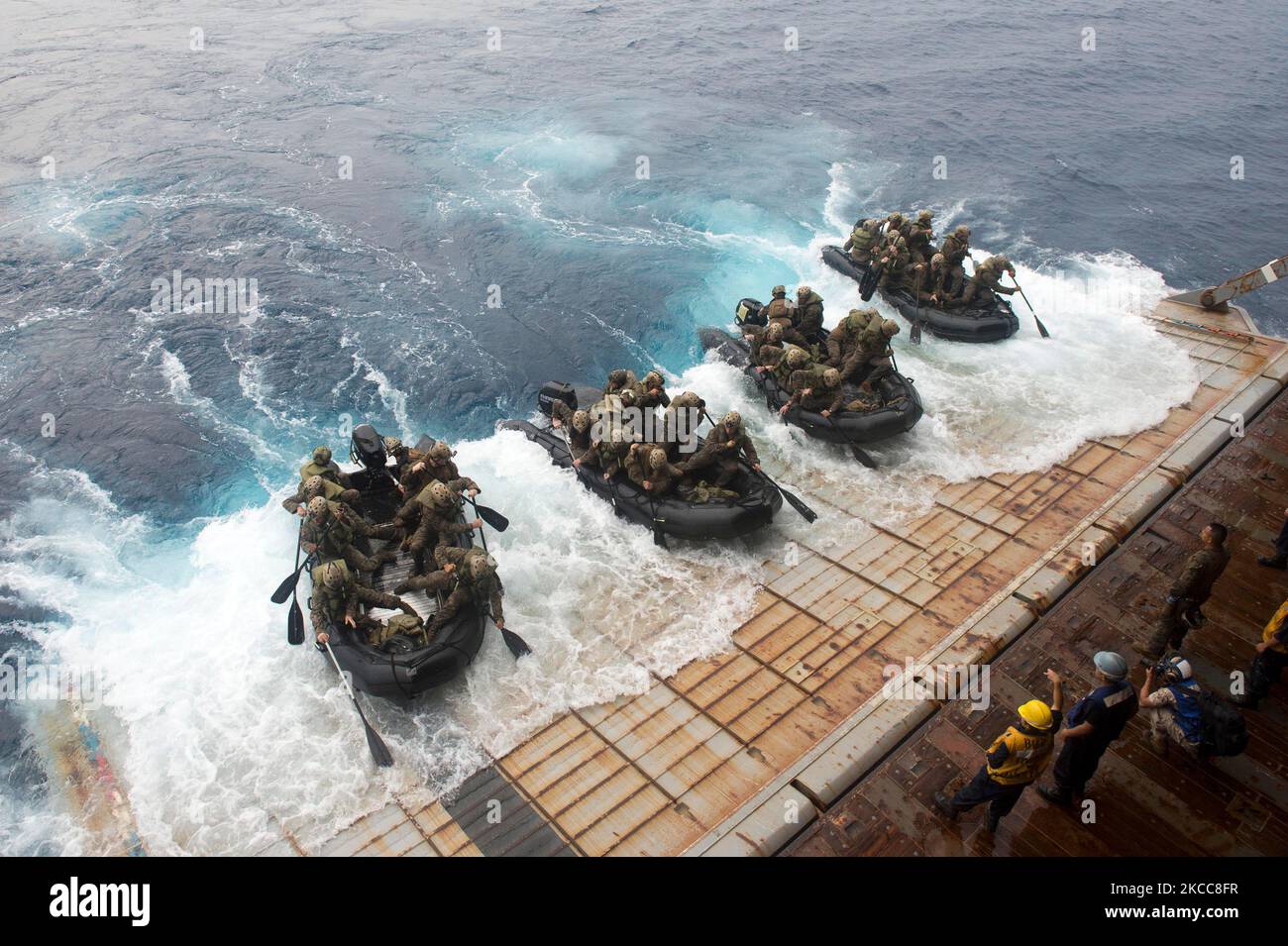 Marines depart the well deck of the amphibious dock landing ship USS ...