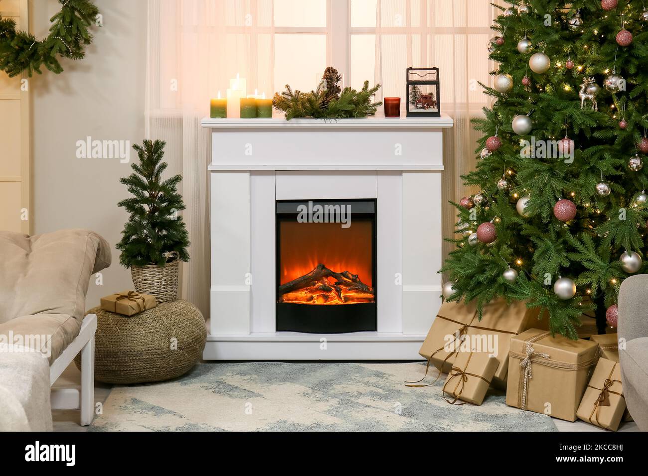 Interior of living room with fireplace, Christmas trees and window ...