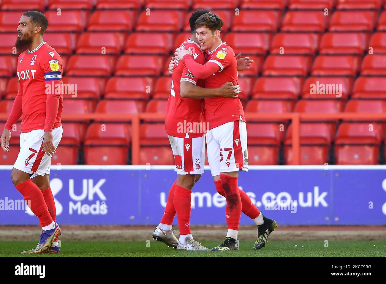 James Garner (37) of Nottingham Forest celebrates with Cyrus Christie ...