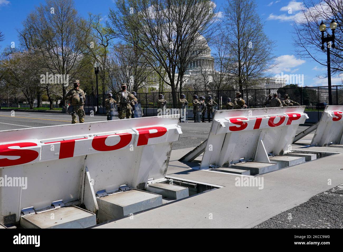 Members of US Capitol police and national guard block the road to ...