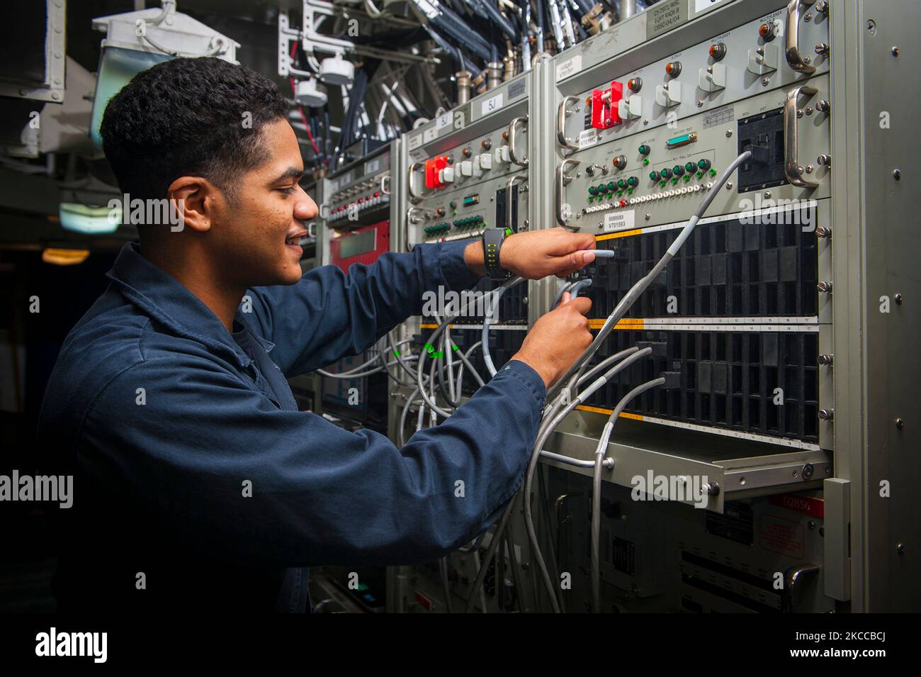 Information System Technician patches signals aboard USS Carl Vinson ...