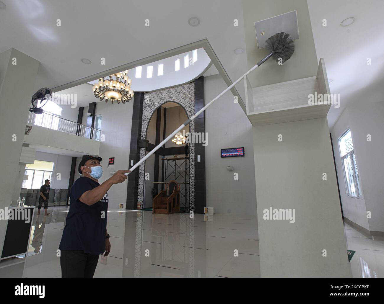 A worker clean the wall of a Mosque in Bogor, Indonesia on April 7 ...