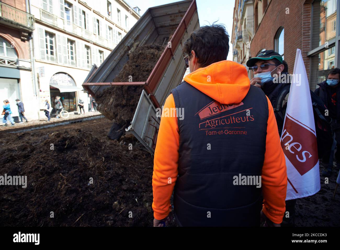 A farmer discharges manure near riot police. Several hundreds of ...