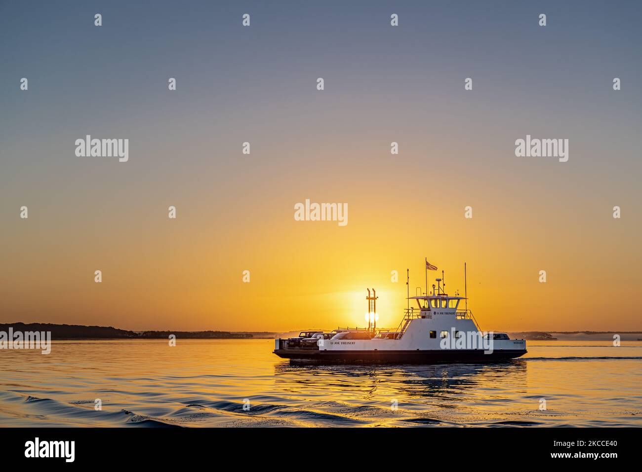 Shelter Island Ferry making an early morning crossing with the sun ...