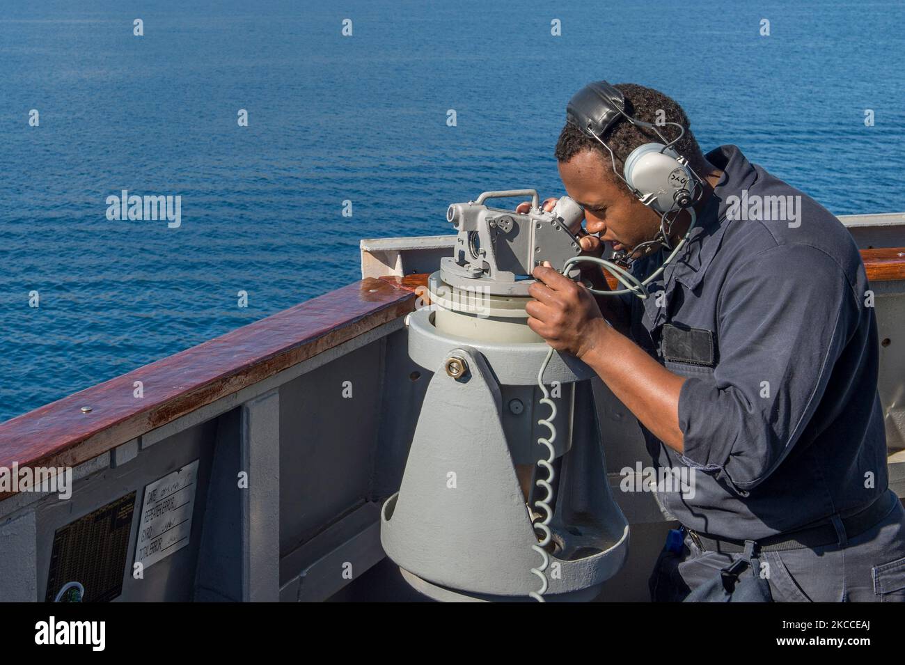 Seaman stands bridge lookout watch aboard USS Laboon Stock Photo - Alamy