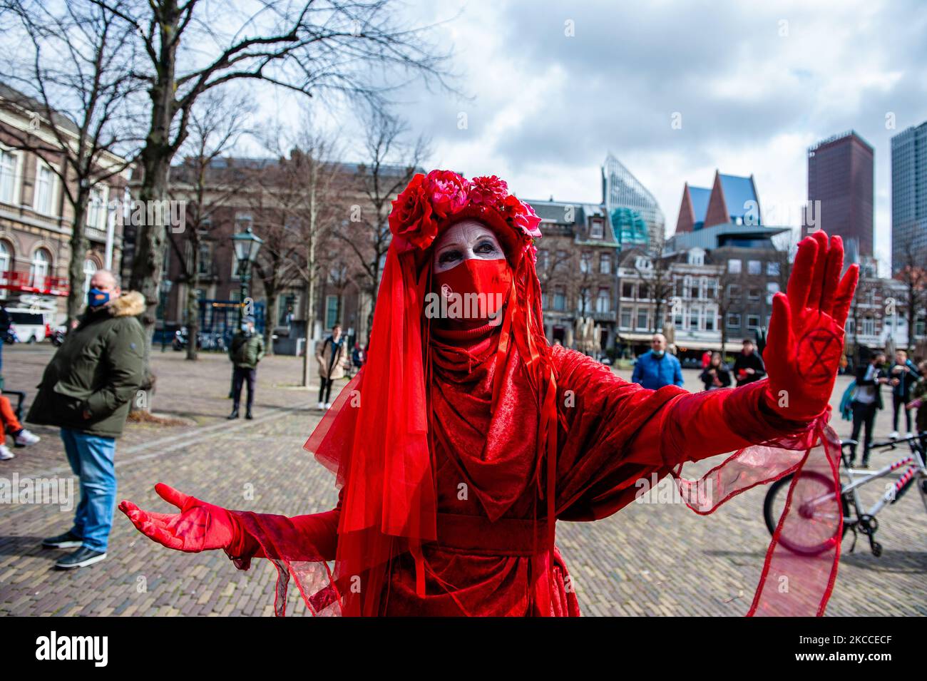 A Red Rebel is performing in front of the House of Representatives ...