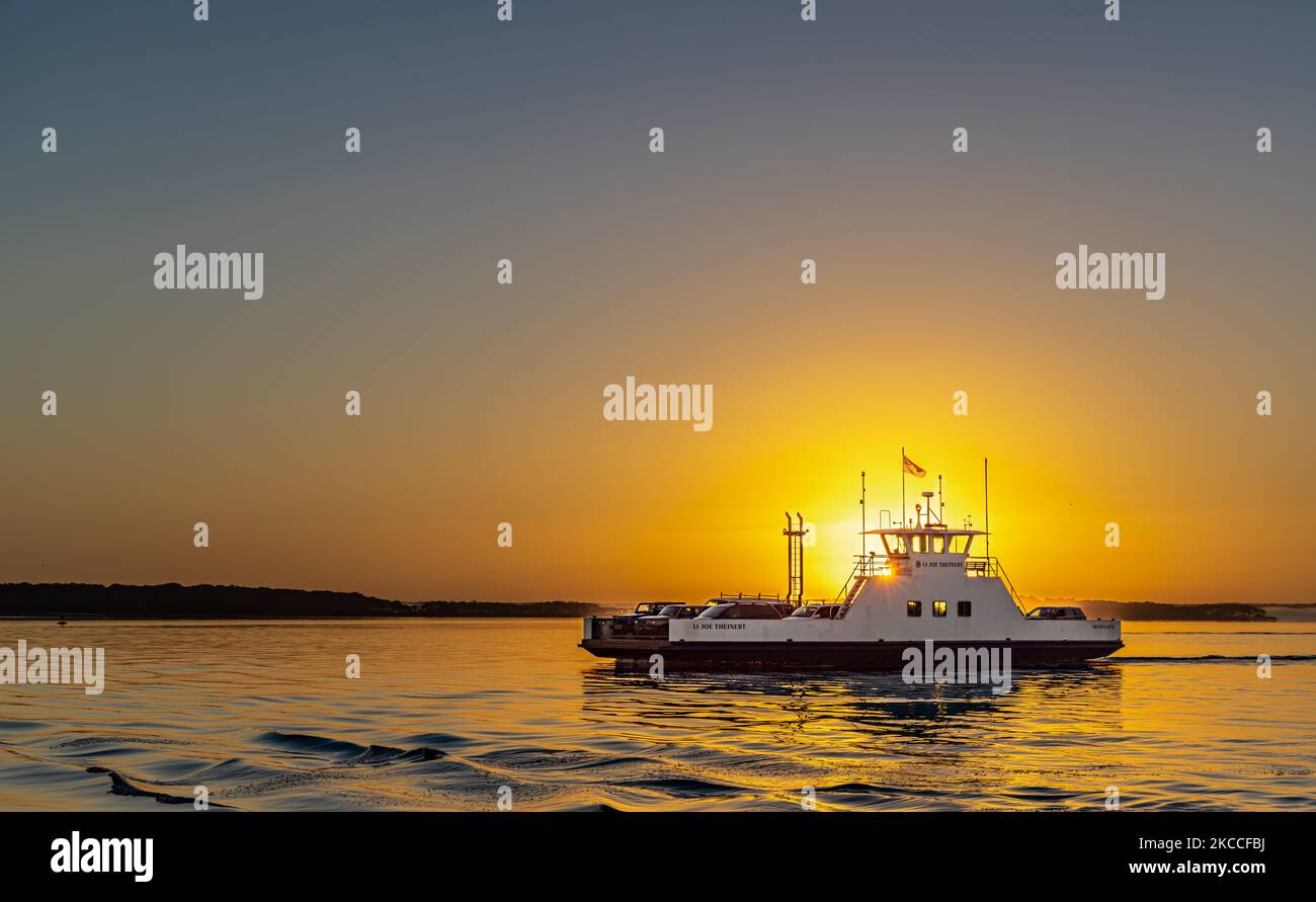 Shelter Island Ferry making an early morning crossing with the sun ...