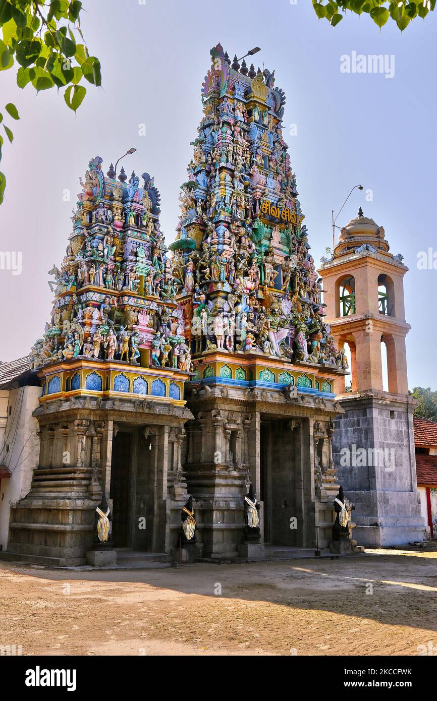 Intricate figures of Hindu deities adorn the gopuram (tower) of the ...