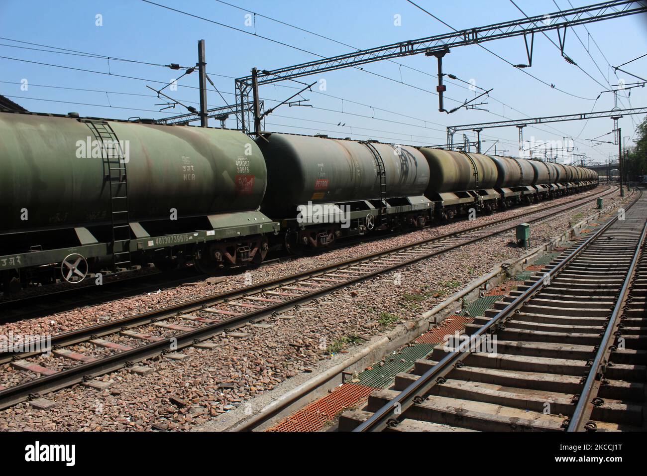 Crude oil, and other petroleum products, are transported in rail tanker ...