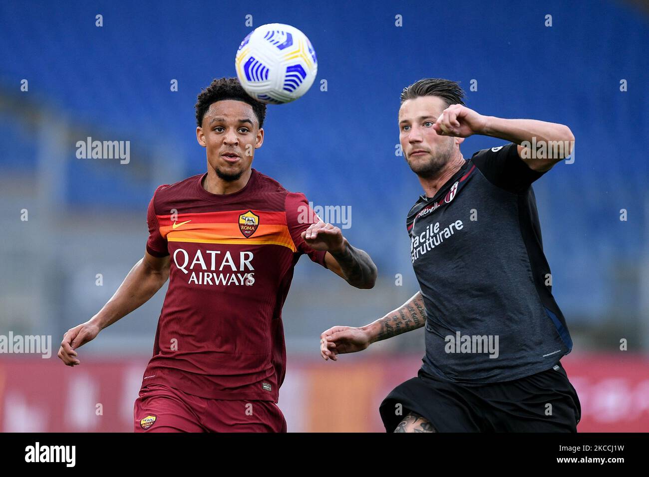 Bryan Reynolds of AS Roma and Mitchell Dijks of Bologna FC compete for ...