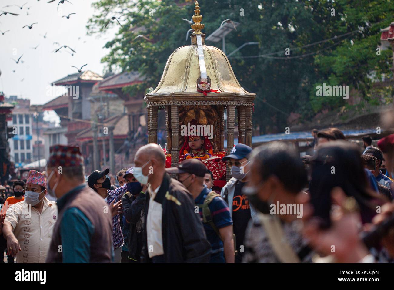 Nepal's Living Goddess, also known as Kumari is carried by devotees ...