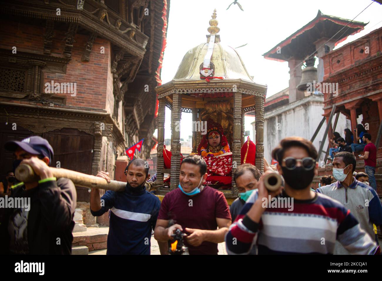 Nepal's Living Goddess, also known as Kumari is carried by devotees ...