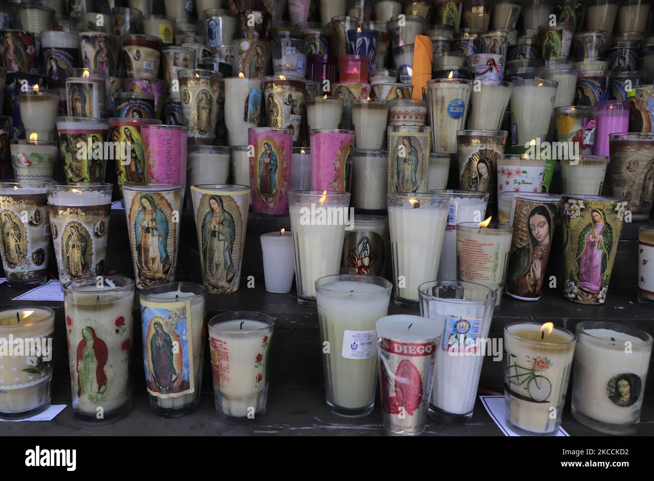 Candles at the memorial dedicated to the deceased and ill people of ...