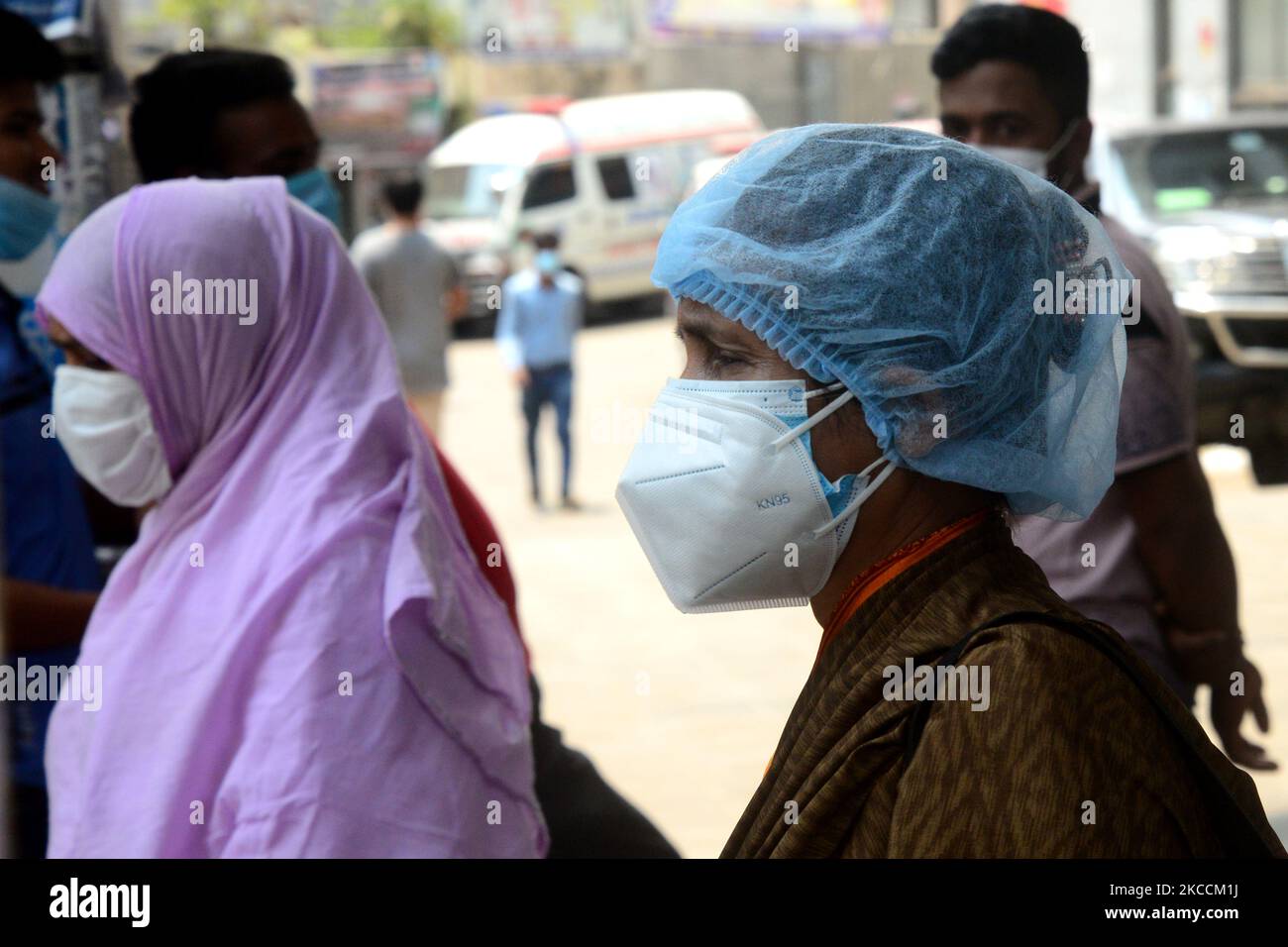 Visitors wearing face mask are seen in front of Dhaka Medical College ...