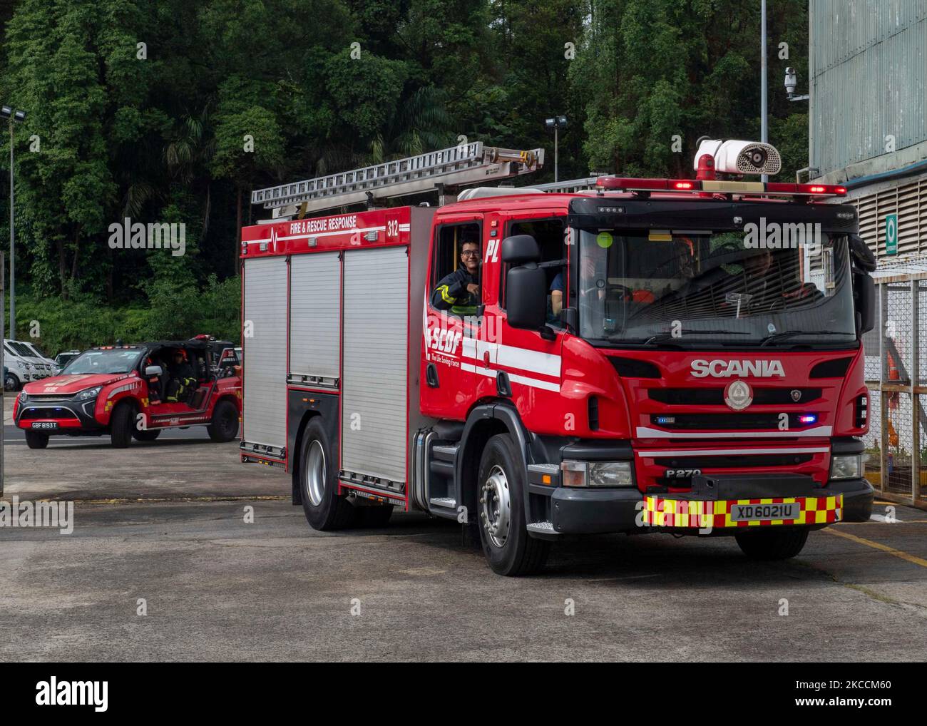 221102-N-HG389-0011 SINGAPORE (Nov. 2, 2022) – Members of the Singapore Civil Defence Force take ...