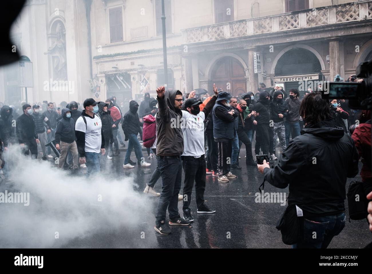 Protesters of small business clash with police officers during a stage ...