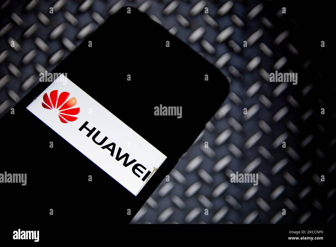 The huawei logo is displayed on a smartphone screen hi-res stock ...
