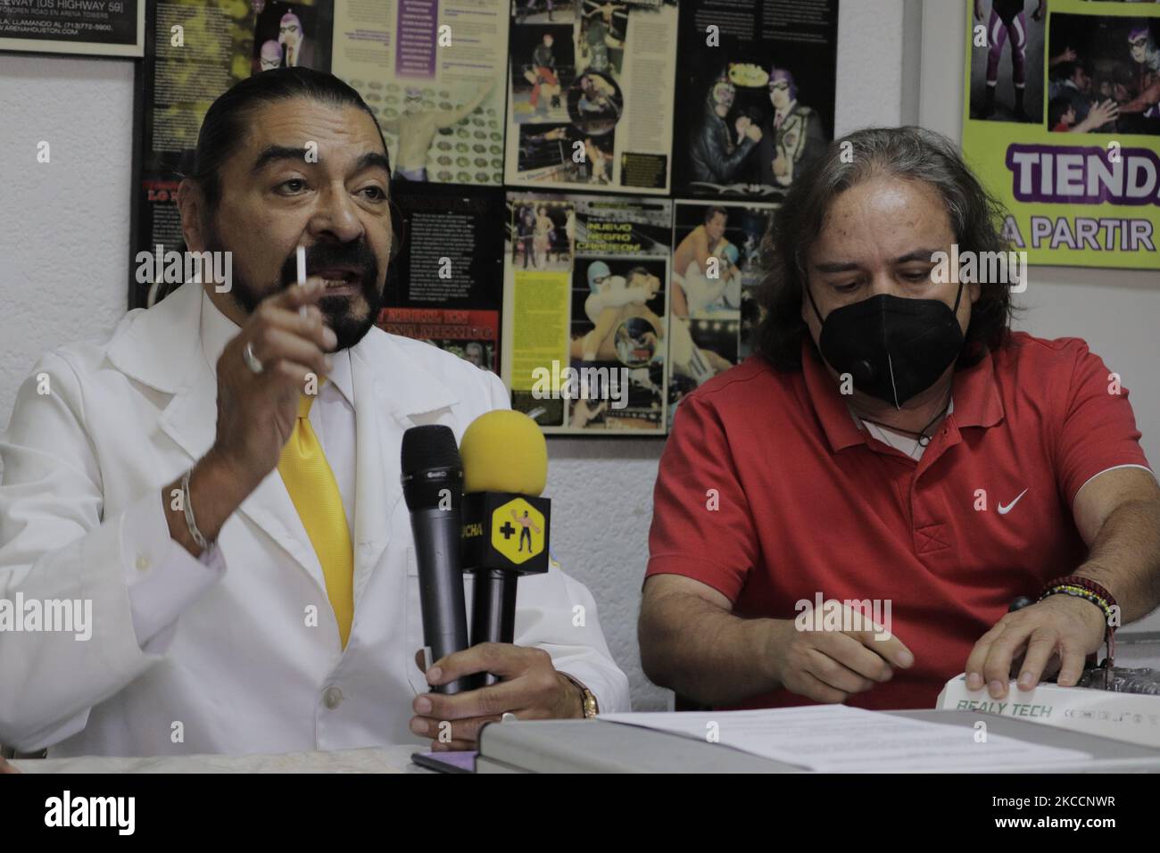On the left, Gabriel Peron, doctor of the wrestling commission in ...