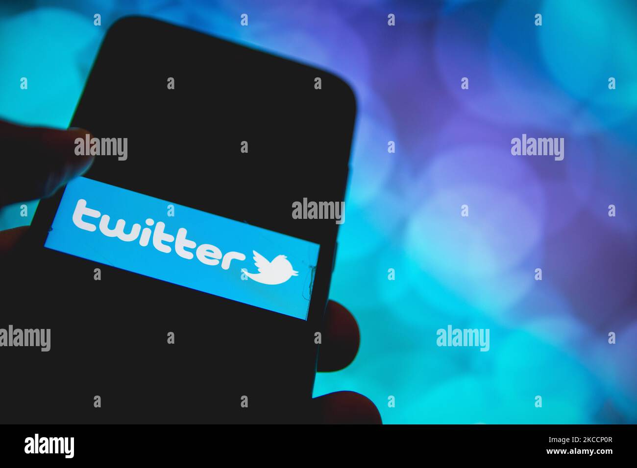 In this photo illustration Twitter logo is displayed on a smartphone ...