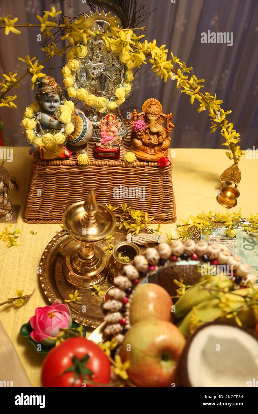 Traditional Vishu kani (Vishukani) setting with a small idol of Lord ...