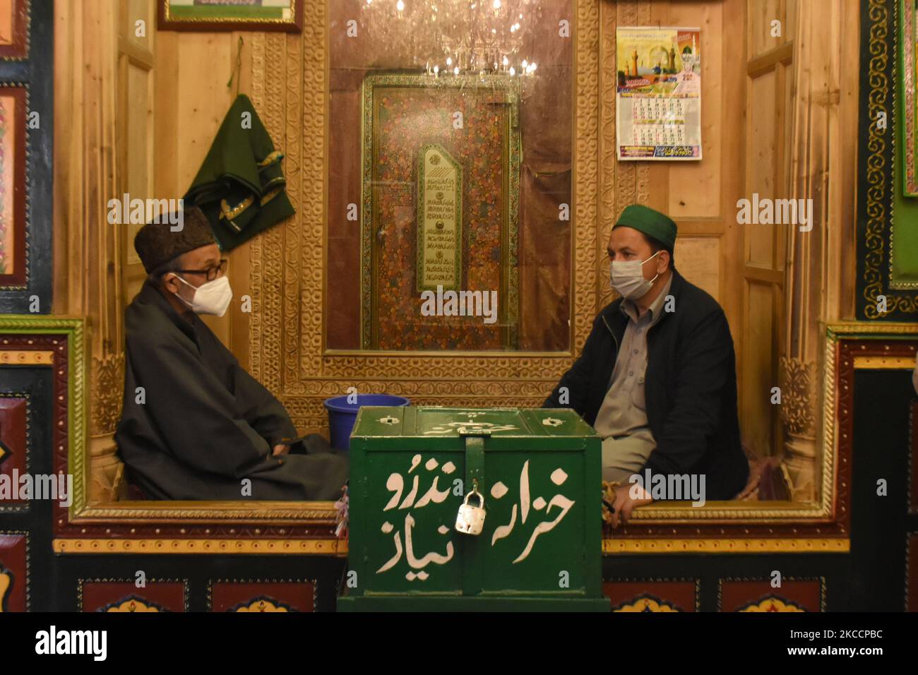 Kashmiri muslims sit inside a shrine on the first day of Ramadan inside ...