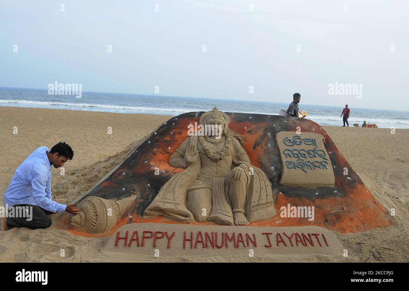 A sand sculpture is seen at the Bay of Bengal Sea's eastern coast beach ...