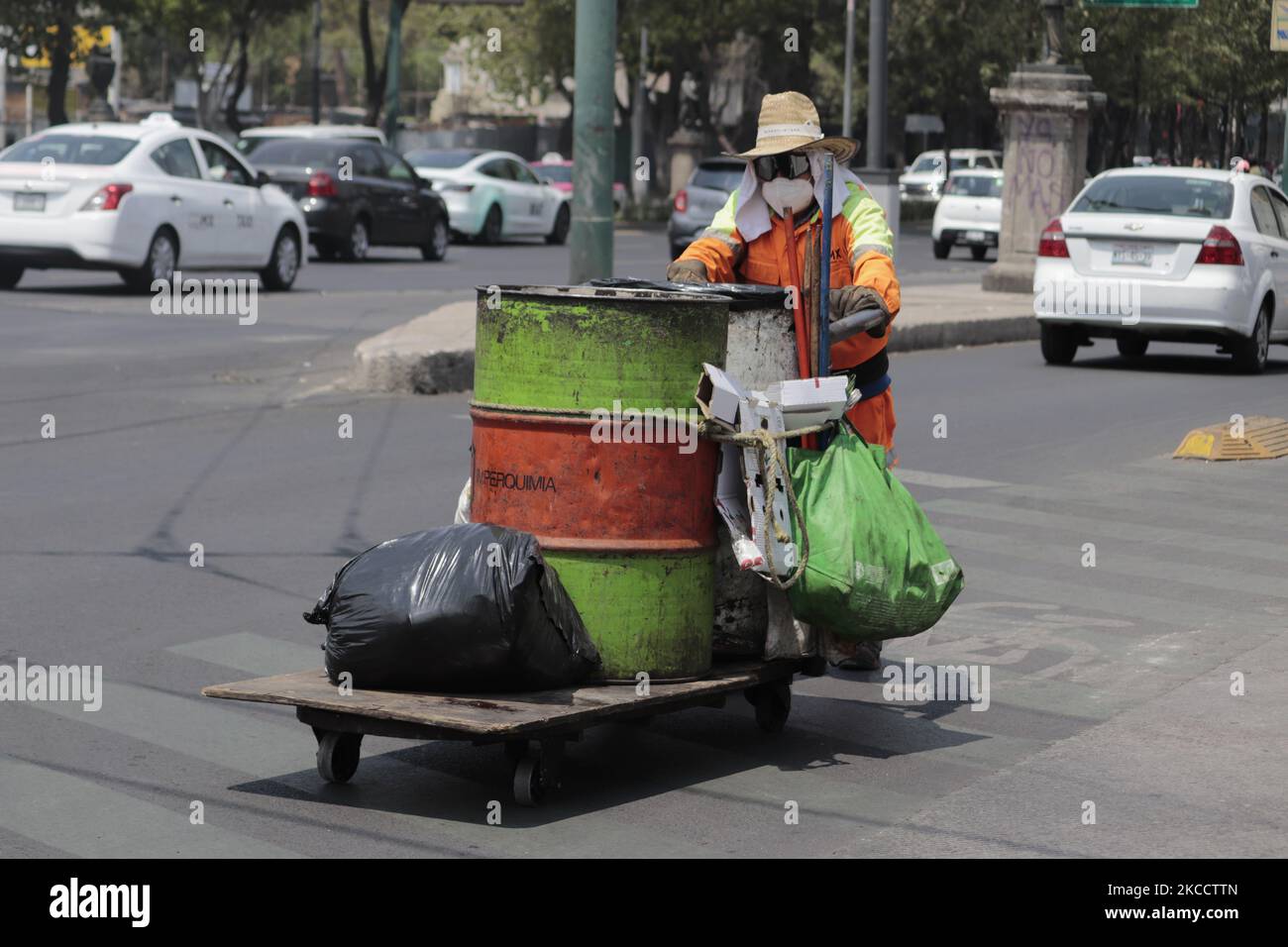 A cleaning worker on Reforma Avenue in Mexico City, during the health ...