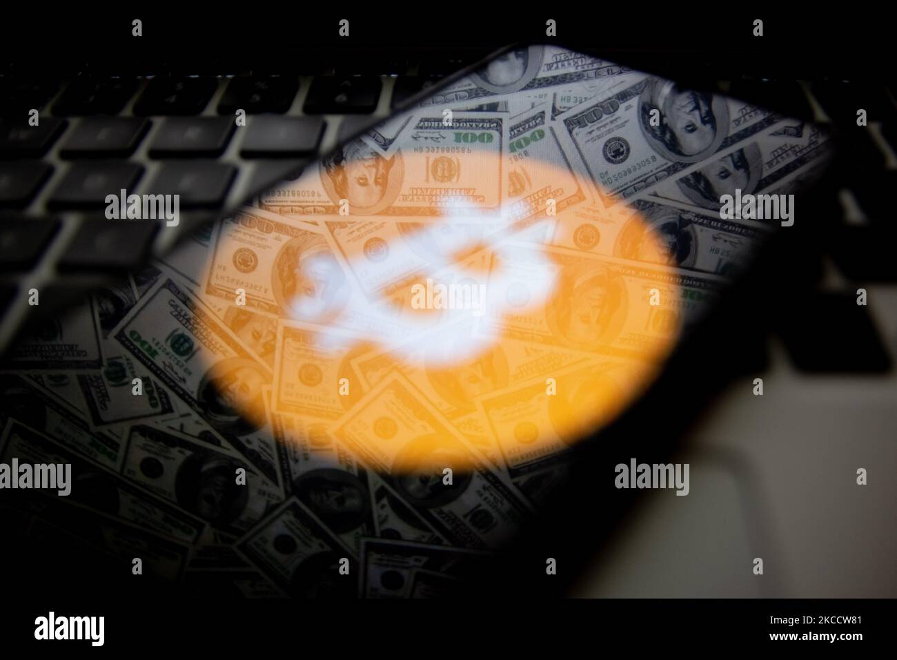 In this photo illustration Bitcoin logo is displayed on a smartphone ...