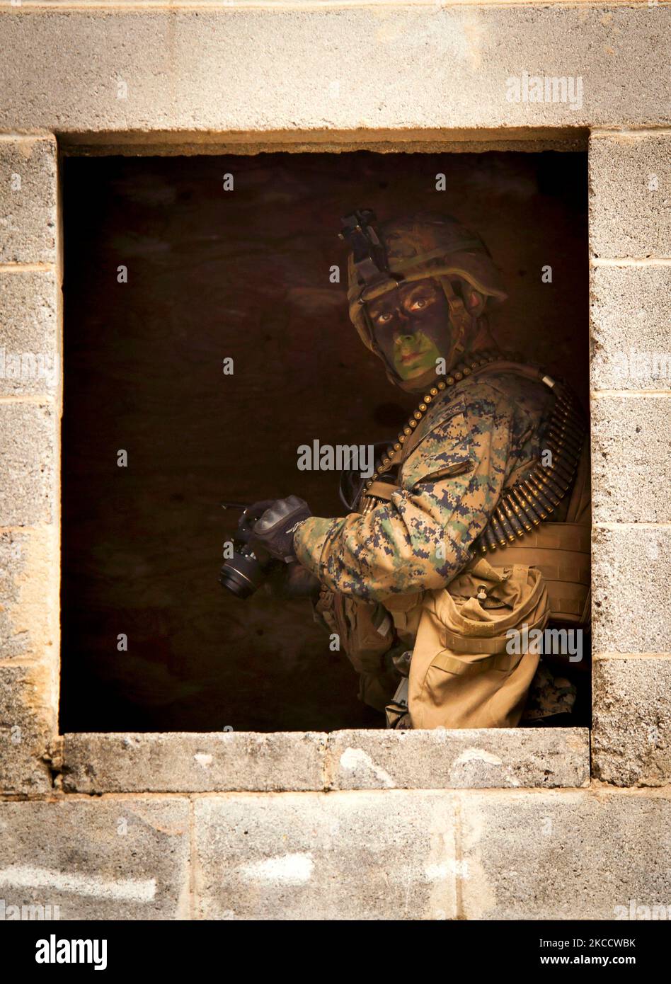 A U.S. Marine Corps officer checks his gear during a field exercise ...