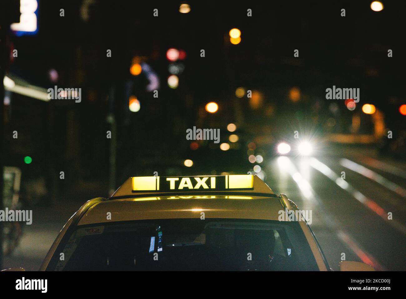 A taxi is seen waiting on the street during the new night curfew time ...