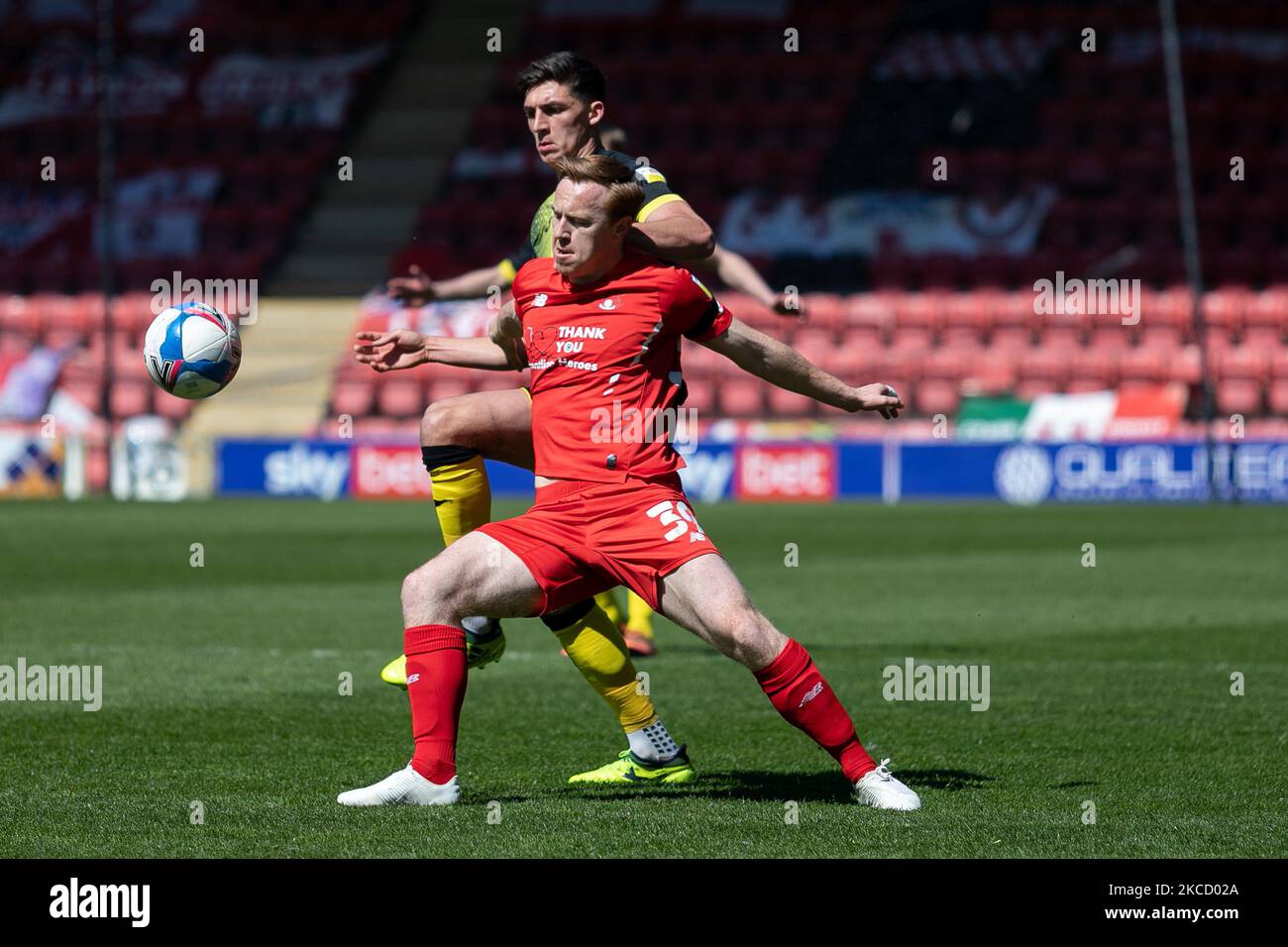 Danny Johnson of Leyton Orient and Bobby Thomas of Barrow compete for ...