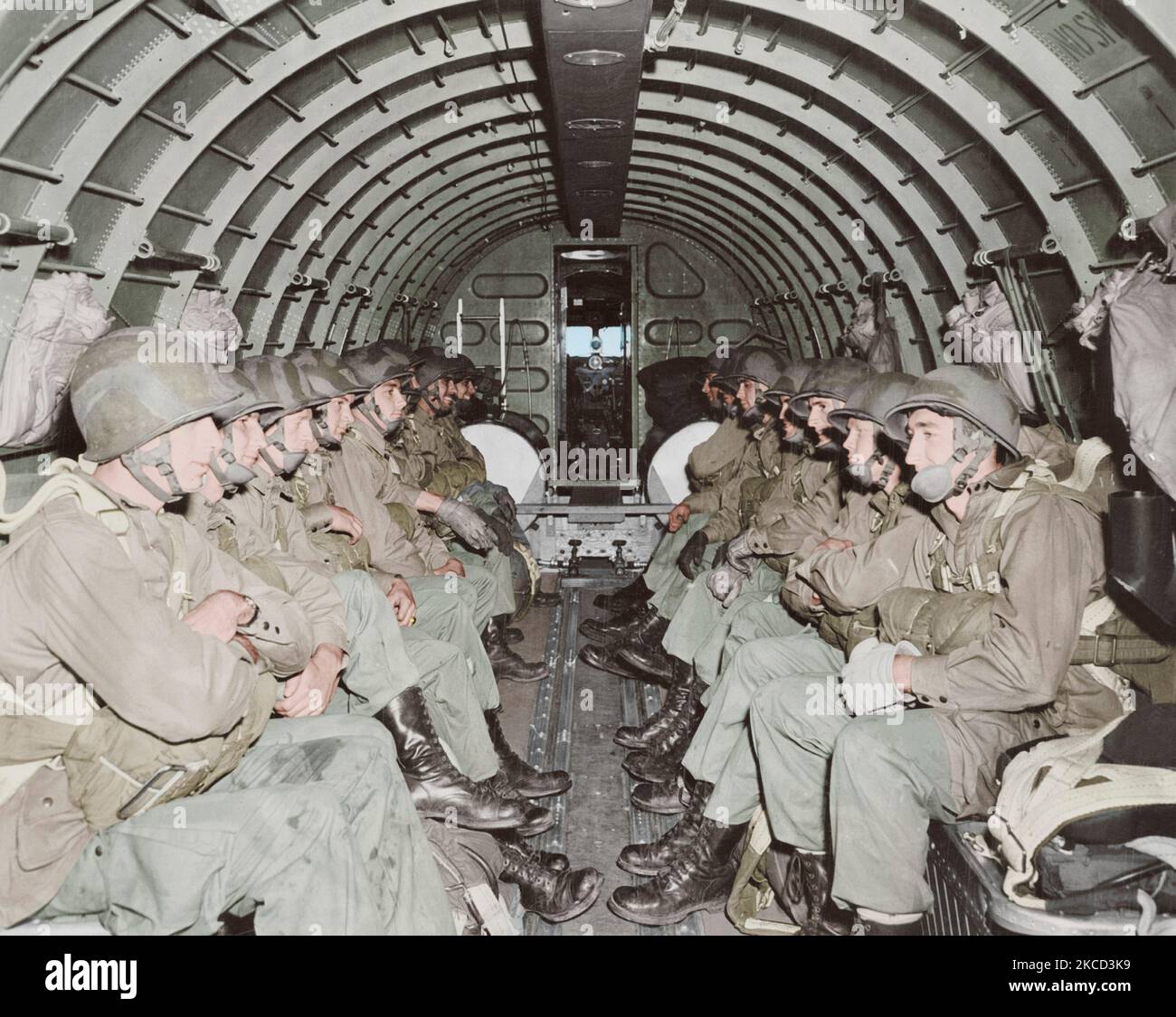 U.S. paratroopers awaiting orders to jump while over England, circa ...