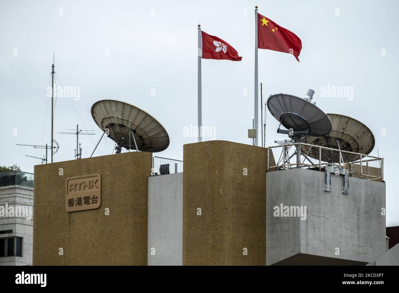 A Hong Kong and China Flag flies on top of the RTHK Television House in ...