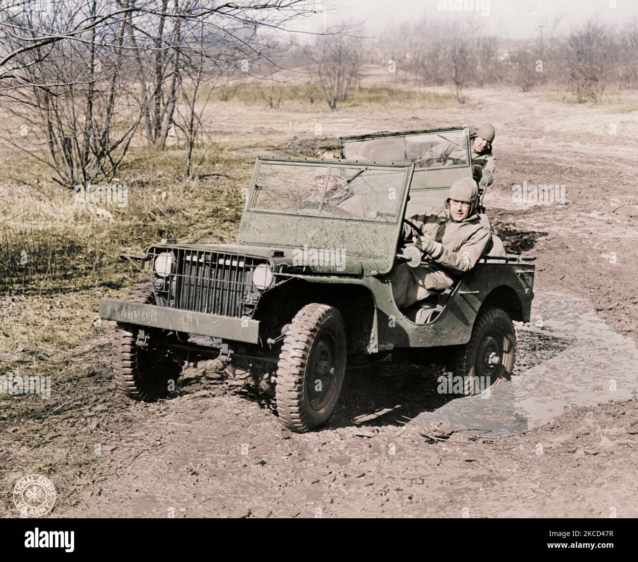 American soldiers driving a jeep on the vehicle training ground, 1942 ...