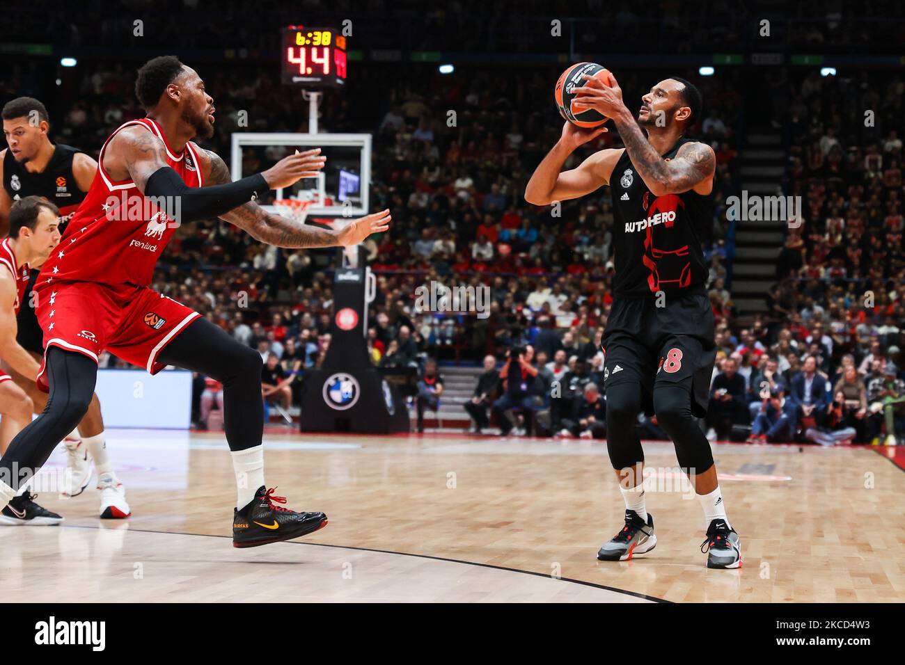 Adam Hanga of Real Madrid (R) and Deshaun Thomas of EA7 Emporio Armani ...