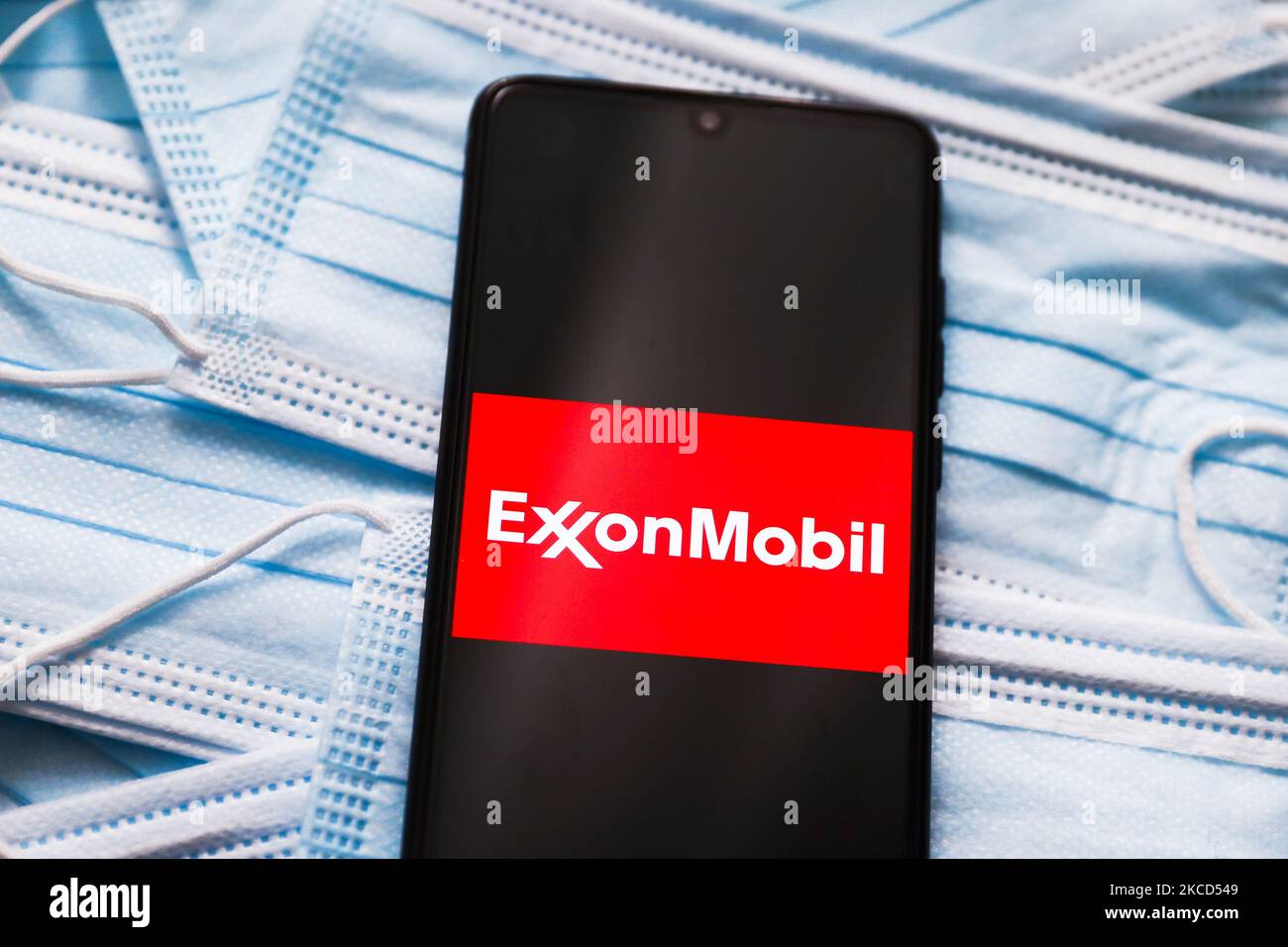 Exxon Mobil Corporation logo is displayed on a mobile phone screen ...