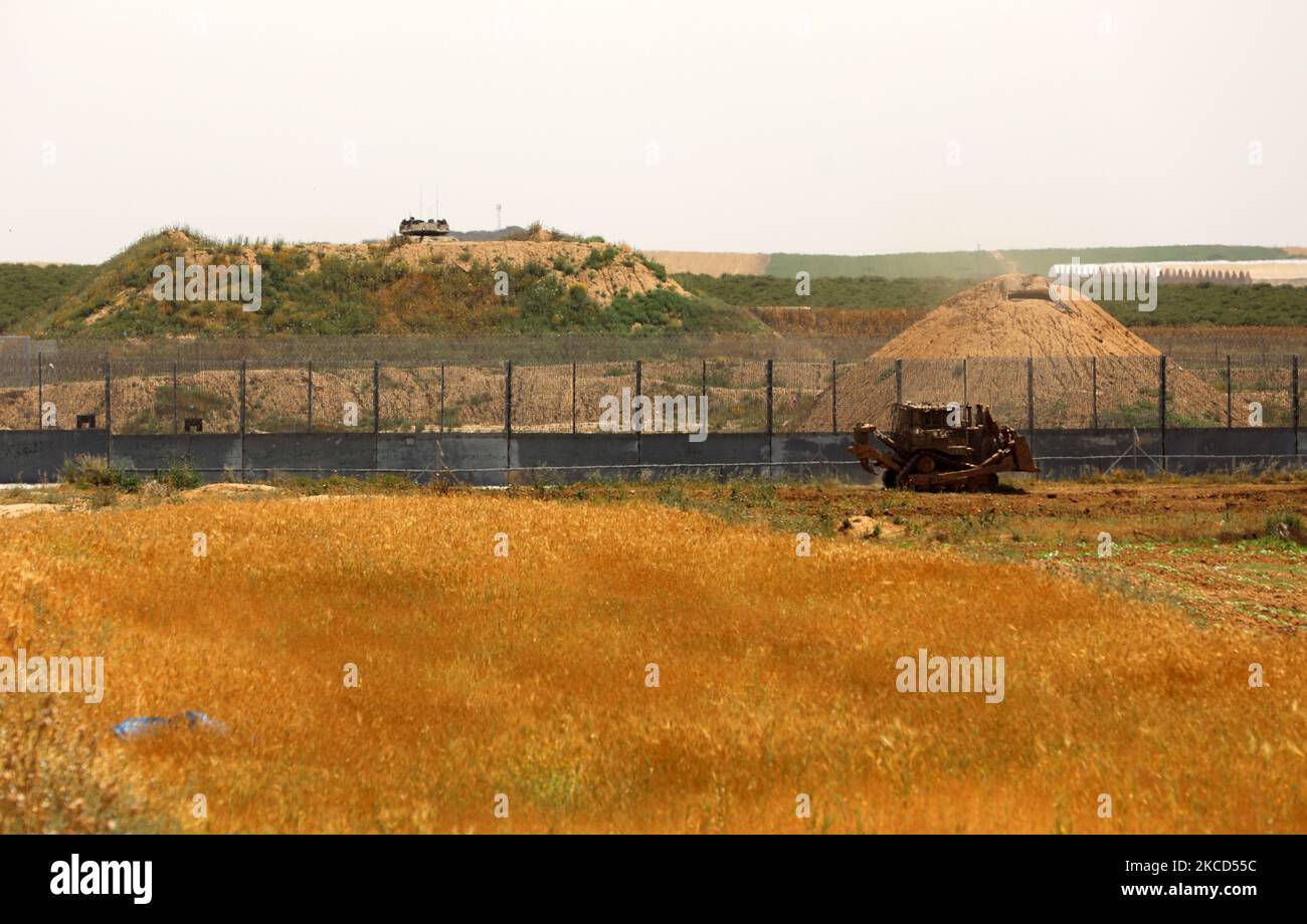 Israeli bulldozers work at the Israel-Gaza border, east of Gaza City on ...