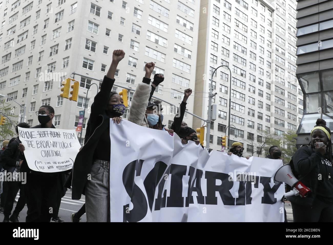 Demonstrators march through the streets against racism and inequality ...