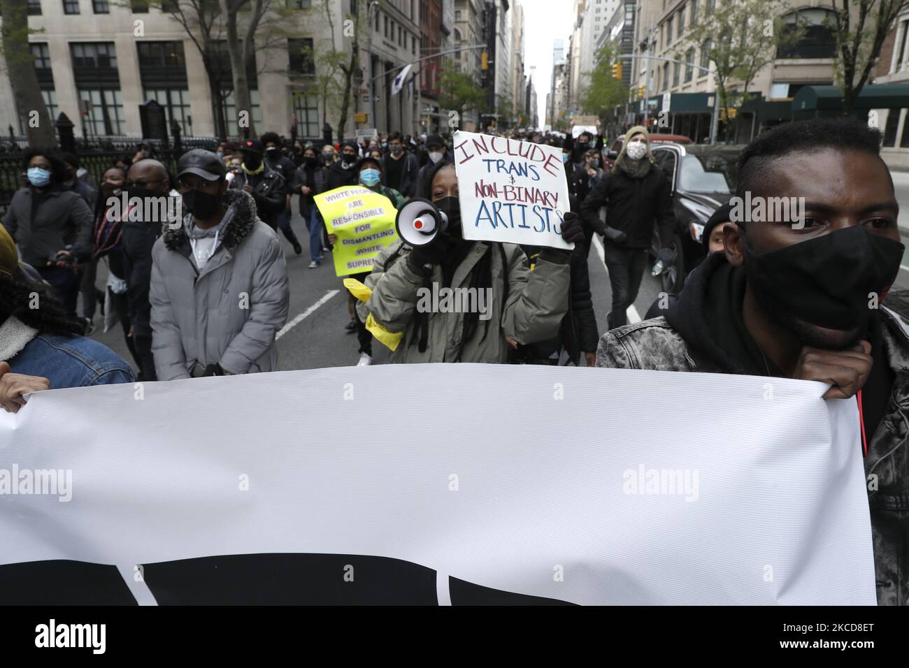 Demonstrators march through the streets against racism and inequality ...