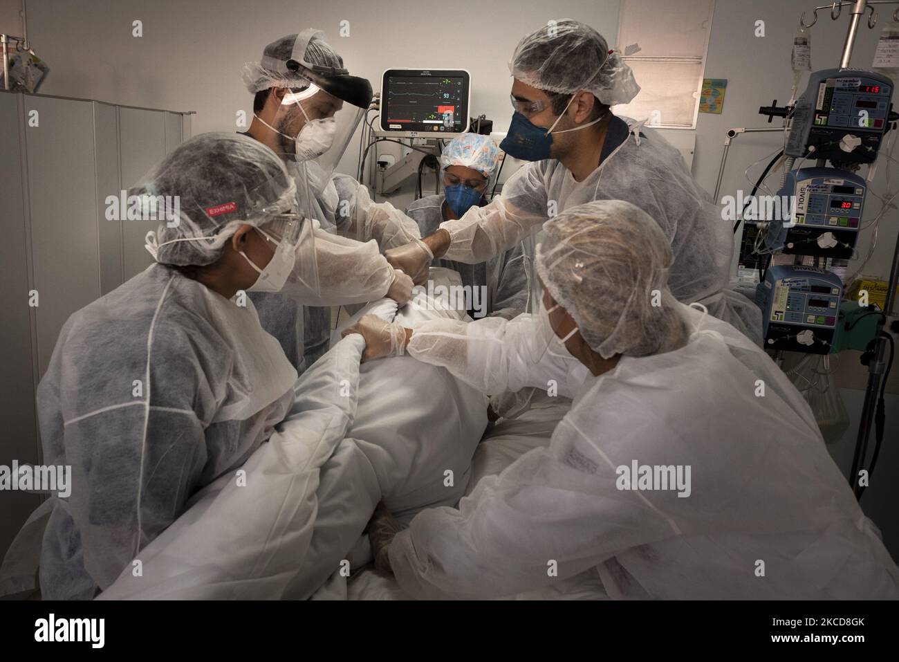 12.Mar.2021 - Team rotates patient in prone position for treatment ...