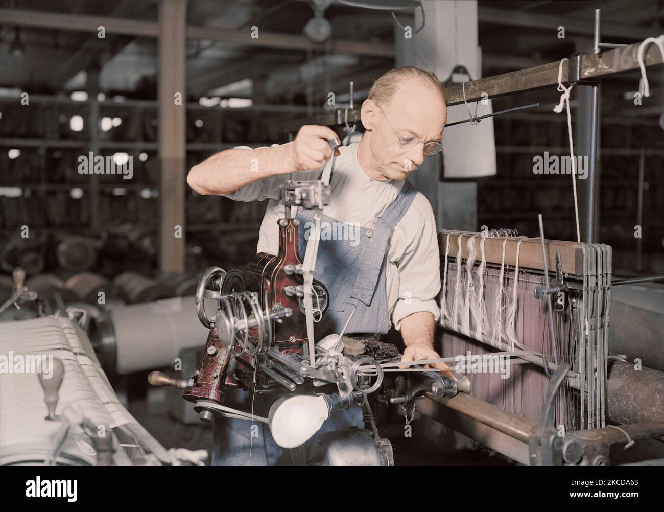 Loom worker at the William Skinner and Sons Silk Mill, 1936 Stock Photo ...
