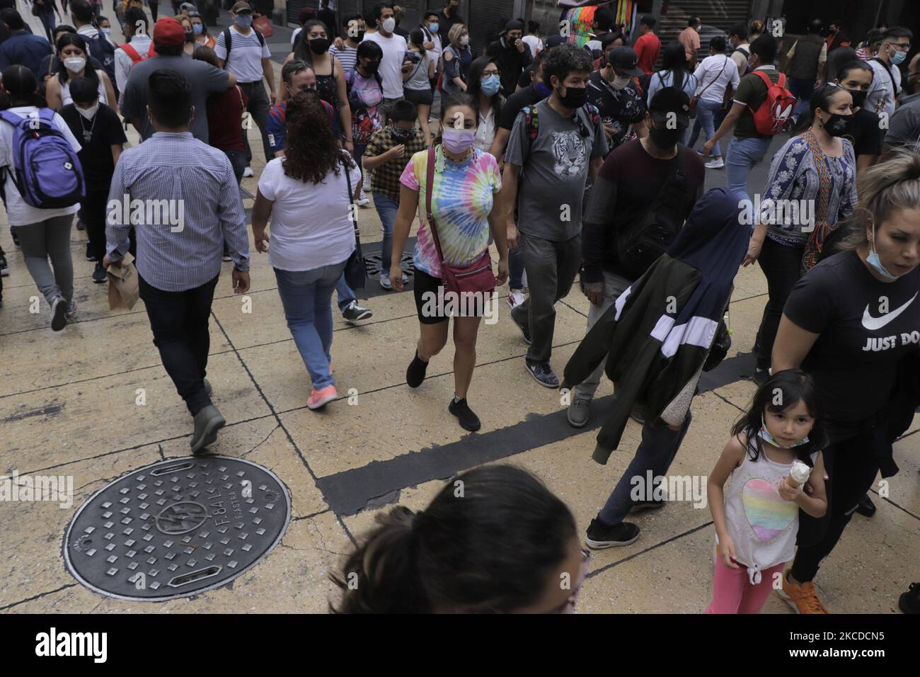 Passersby in the main square of Mexico City's Zócalo, Mexico, on April ...