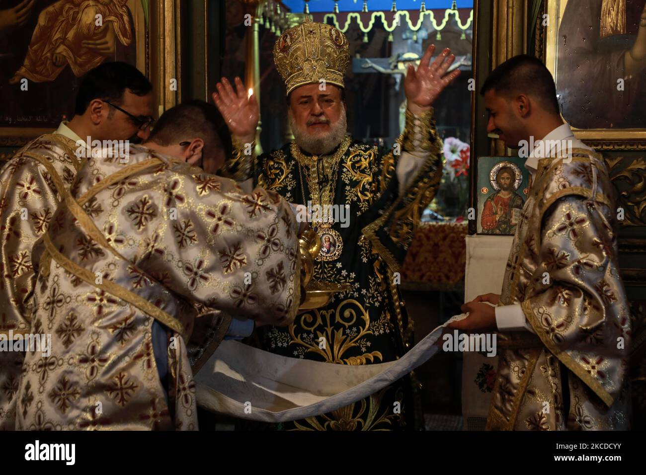 Christians take part in Palm Sunday Mass in the Church of Saint ...