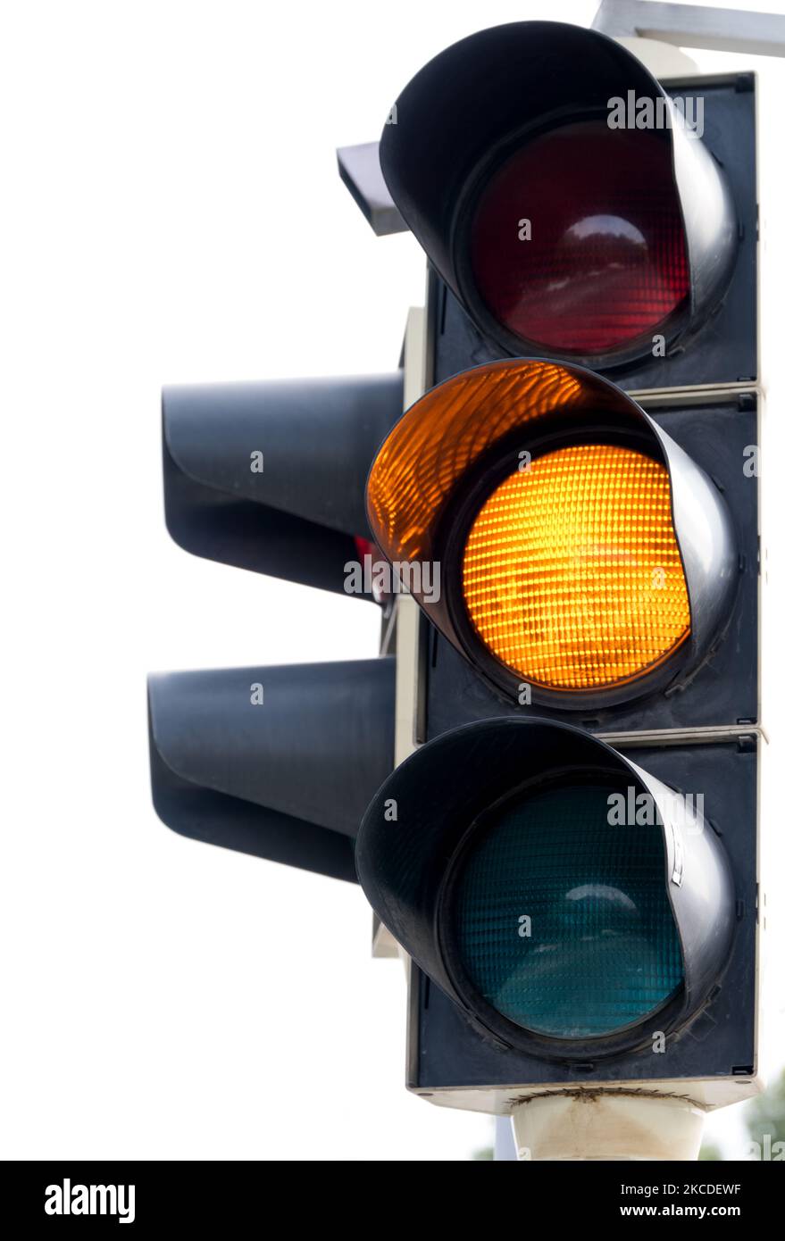 Close up of traffic light showing orange yellow light as concept for ...