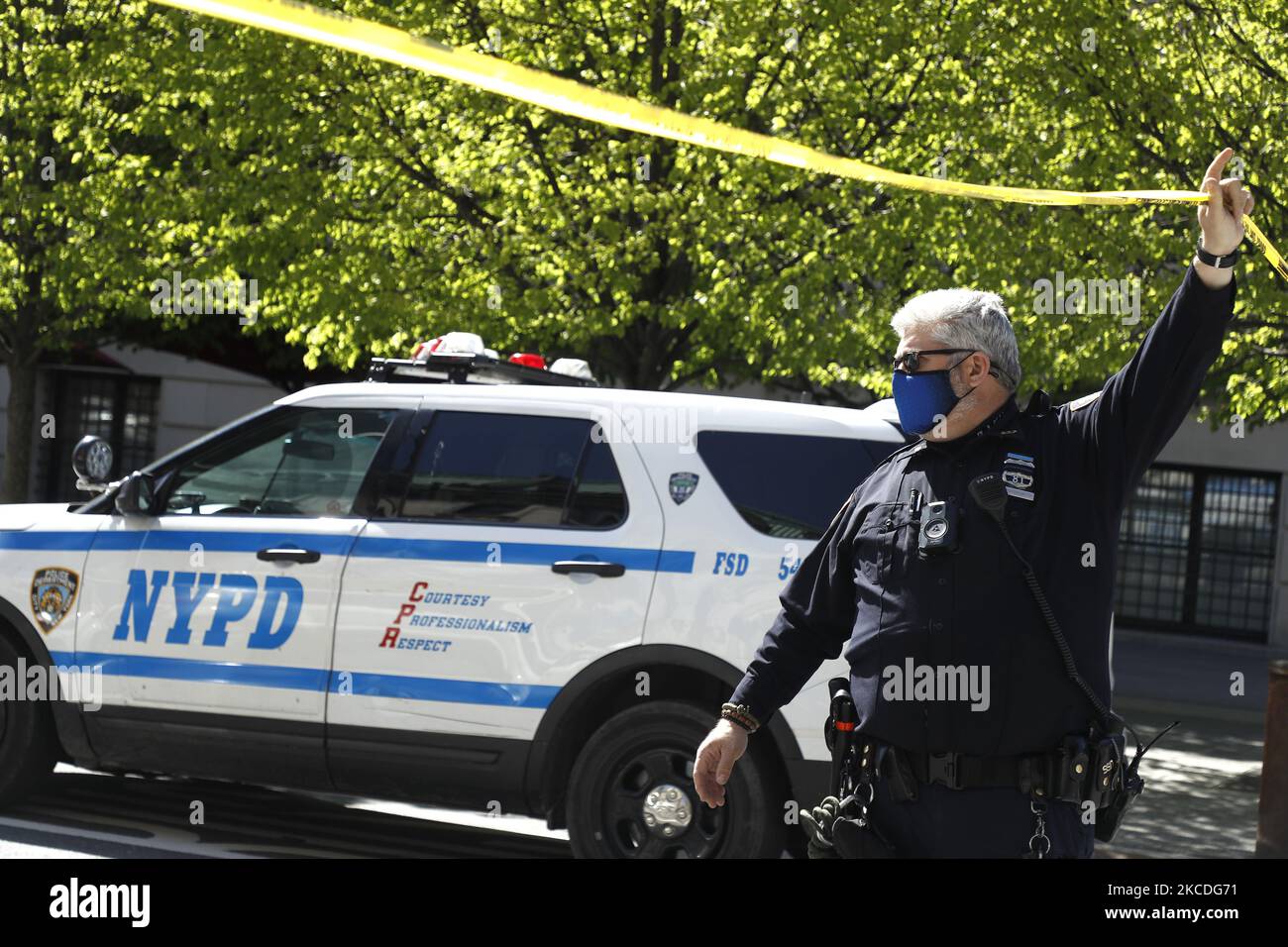Police officers stand at a street closure point after the New York ...