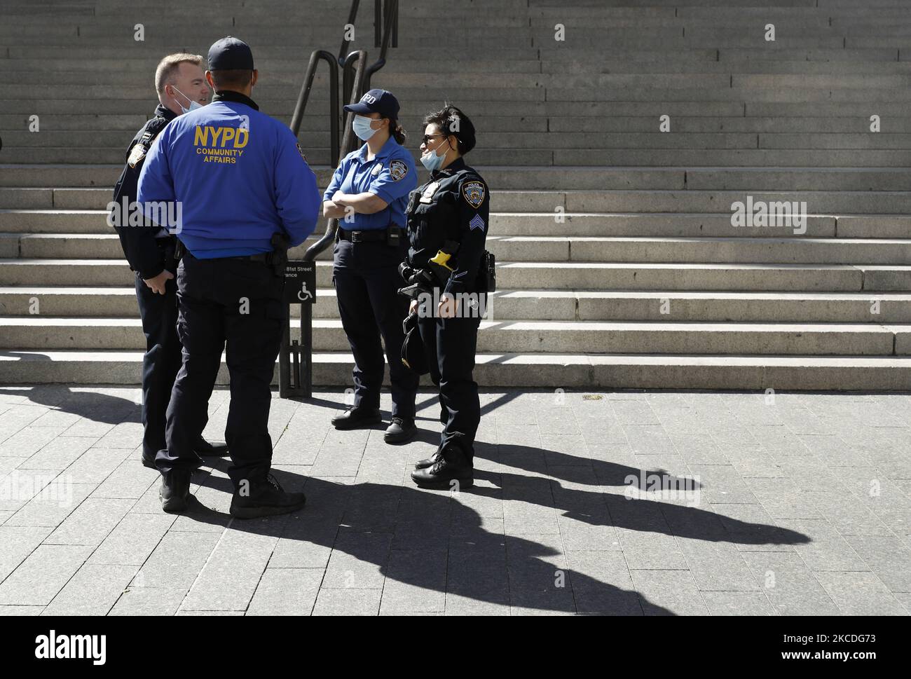 Police officers engage in conversation after the New York Police ...